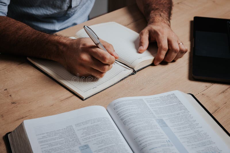 Man is Ready To Study the Bible and Make Notes in His Notebook Stock ...
