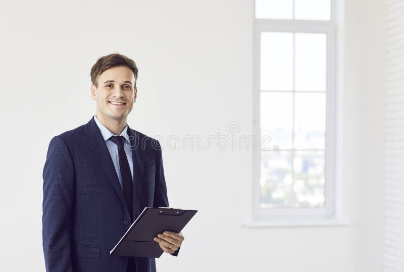 Man Realtor Agent Standing in Empty Apartments with Documents in Hands ...