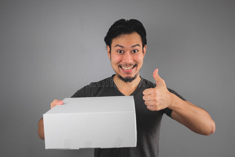 Man received his box. stock photo. Image of confident - 61204308