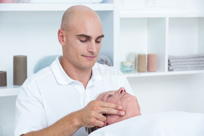 Man receiving head massage stock photo. Image of room - 54261668