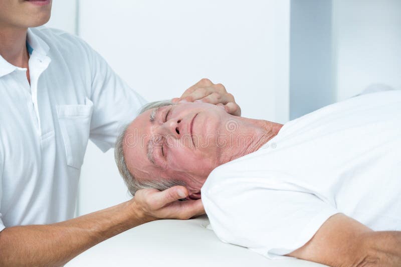 Man receiving head massage stock photo. Image of room - 54262566