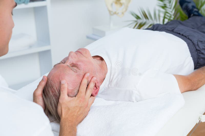 Man receiving head massage stock image. Image of elderly - 54759805