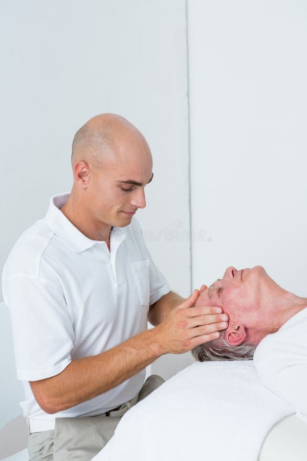 Man receiving head massage stock photo. Image of massage - 54759956