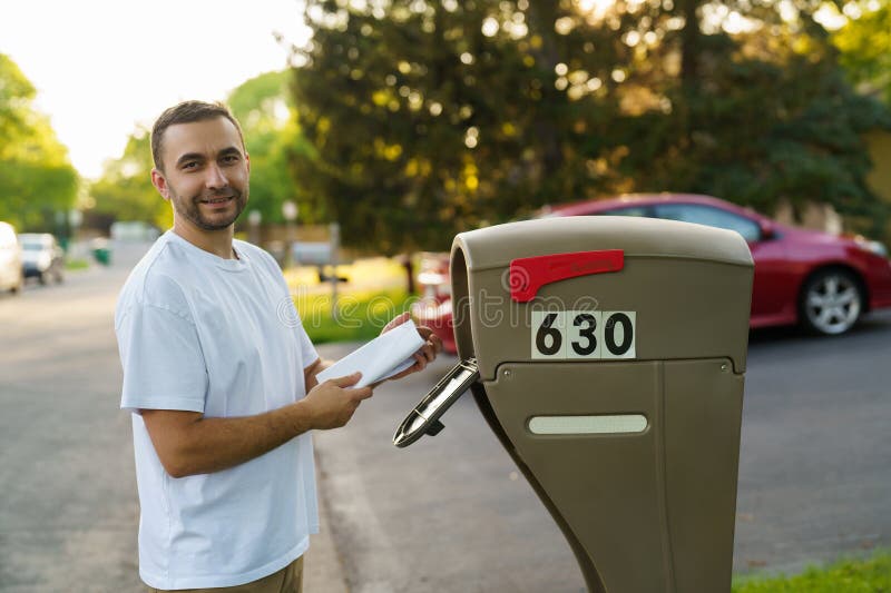 Man Receiving Letters and Bills in Mailbox in Front of House. Mail ...