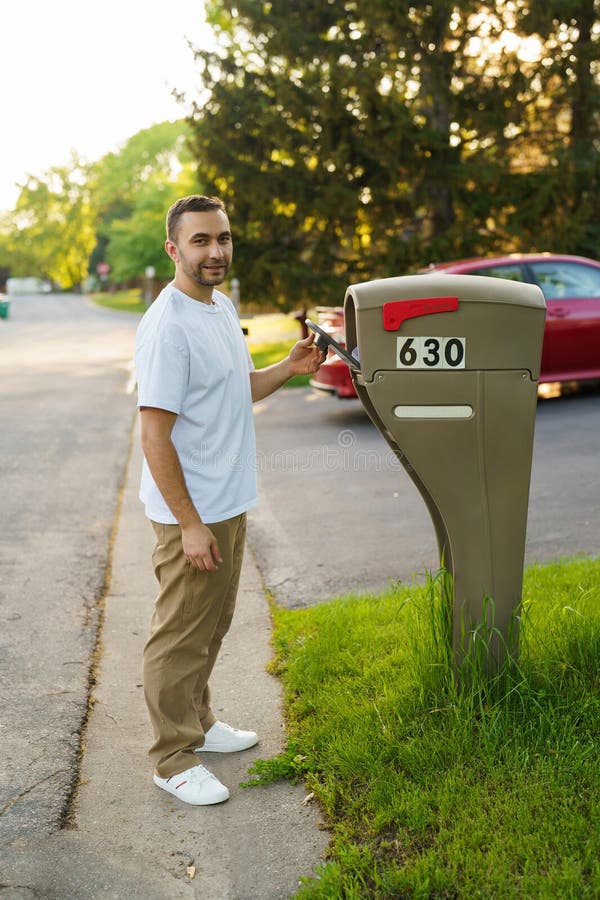 Man Receiving Letters and Bills in Mailbox in Front of House. Mail ...