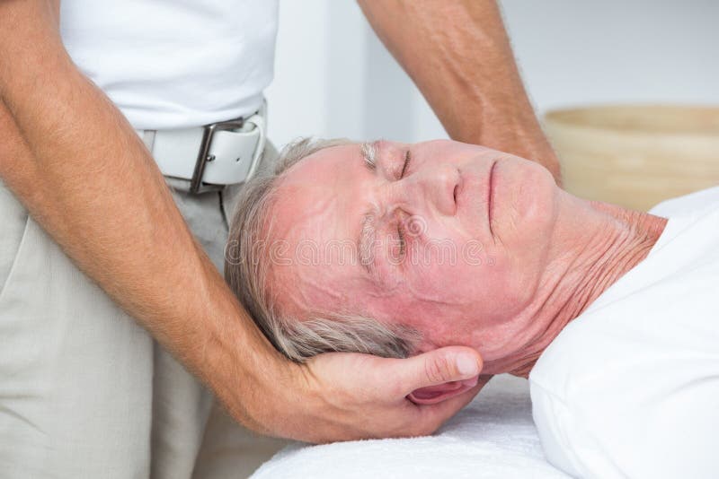 Man receiving neck massage stock photo. Image of senior - 54260820