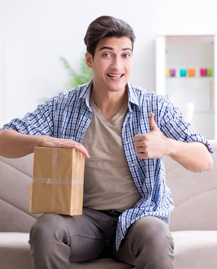 Man Receiving Parcel at Home Stock Image - Image of company, cardboard ...