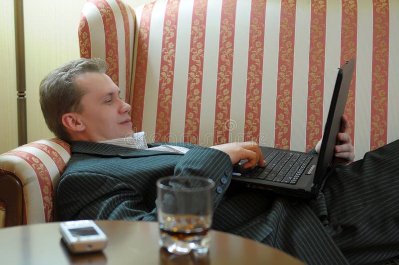 Man reclining with laptop stock photo. Image of reclining - 8450608