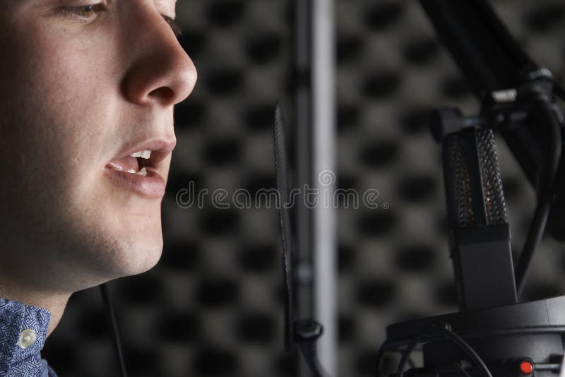 Man in Recording Studio Talking into Microphone Stock Image - Image of ...