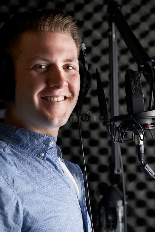 Man in Recording Studio Talking into Microphone Stock Photo - Image of ...