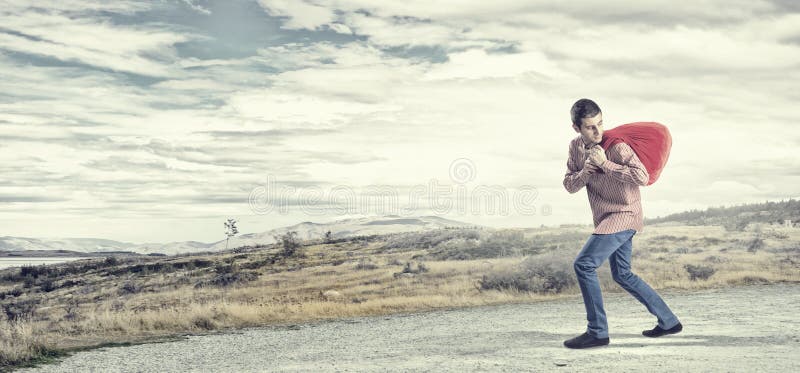 Man with red bag stock photo. Image of december, pack - 48726296