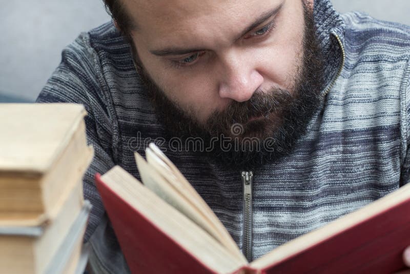 Man with red book stock photo. Image of fashionable, beard - 96151698