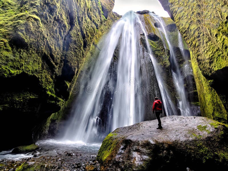 Man in Red Jacket Posing by Gljufrabui Waterfall Stock Photo - Image of ...