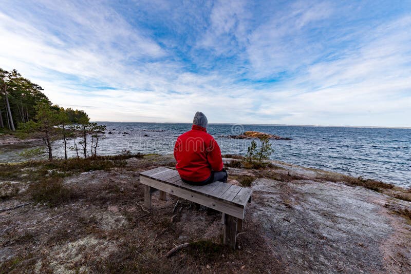 Man in Red Jacket Sitting on a Bench Stock Photo - Image of sweden ...