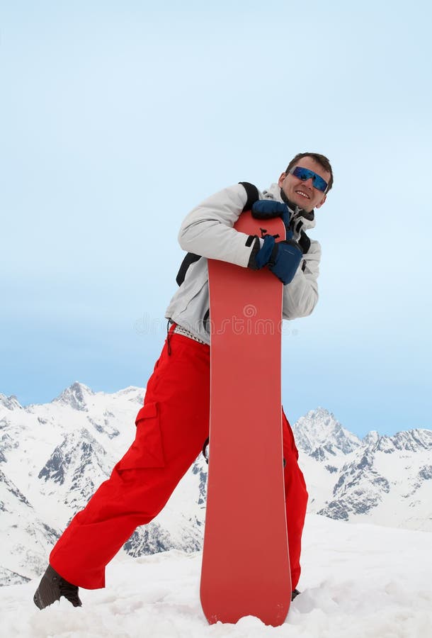 Man with red snowboard stock photo. Image of active, action - 4896050