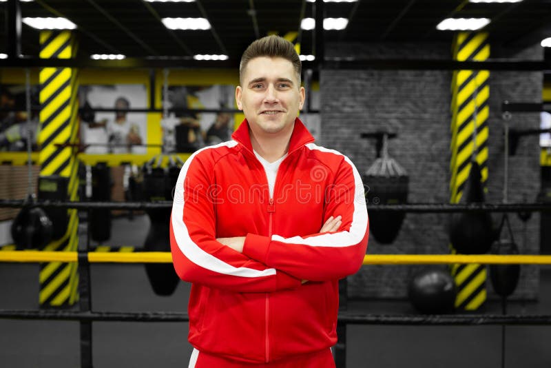 Man in a Red Tracksuit Poses and Has Fun in the Boxing Ring. Stock ...