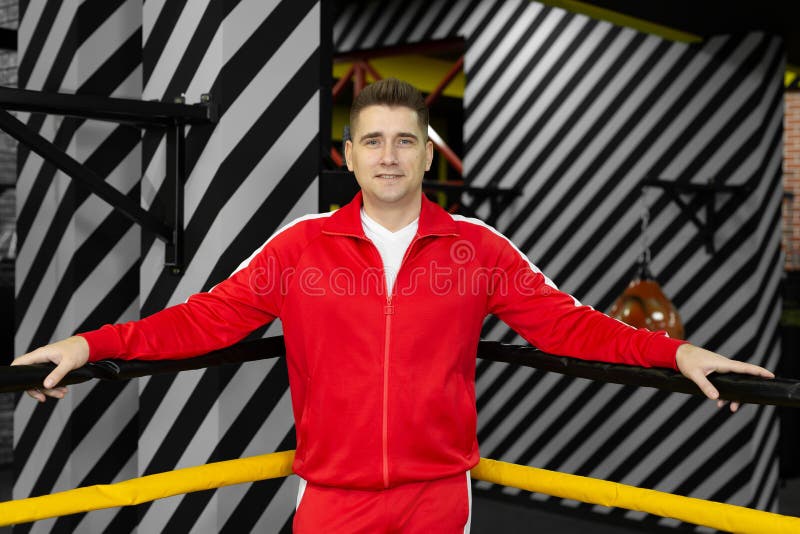 Man in a Red Tracksuit Poses and Has Fun in the Boxing Ring. Stock ...
