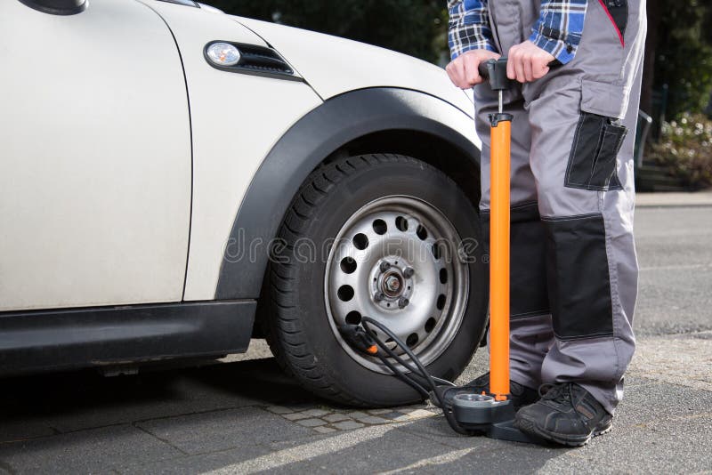 A Man is Refilling a Car Wheel Stock Image - Image of check, compressor ...