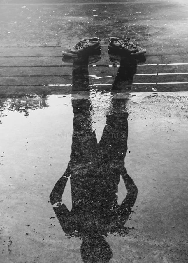 Silhouette, a Man Walking with Reflection on Water Stock Photo - Image ...