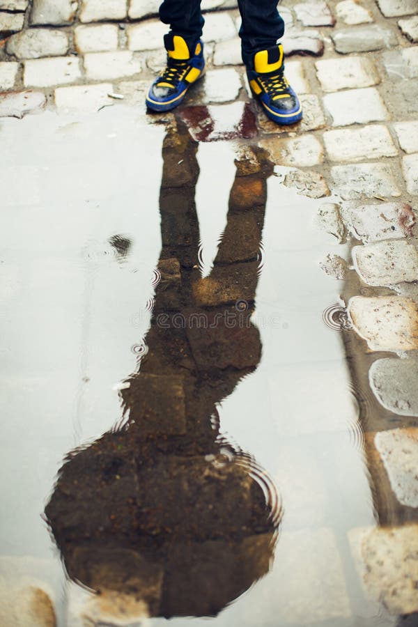 Man Reflection in the Water Stock Photo - Image of paving, blue: 59348416