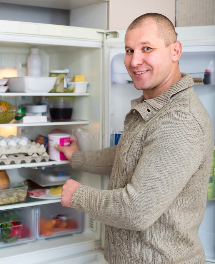 Man and refrigerator stock photo. Image of person, positive - 51239810