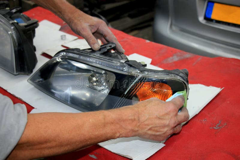 Man Refurbishing Car Headlight Stock Image - Image of body, industry ...