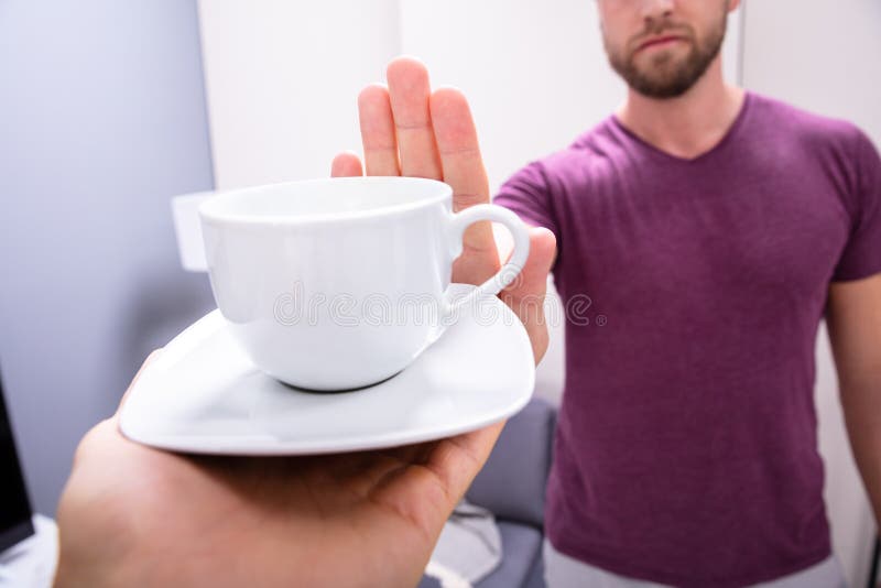 Man Refusing Cup of Coffee stock image. Image of problem - 210426493
