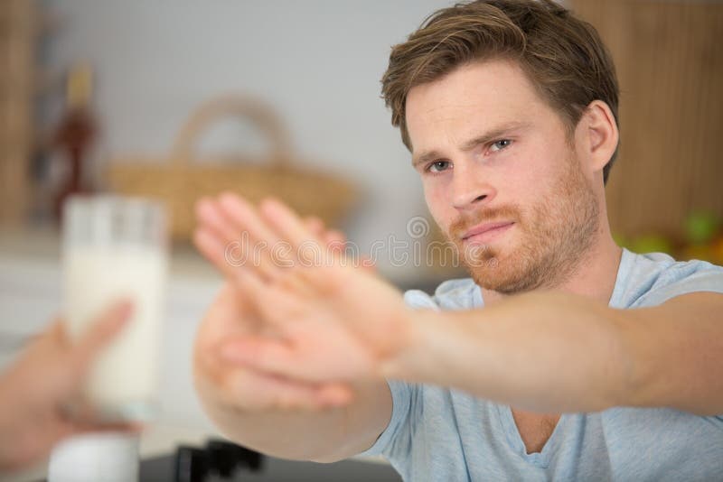 Man refusing glass milk stock image. Image of gastritis - 262851619