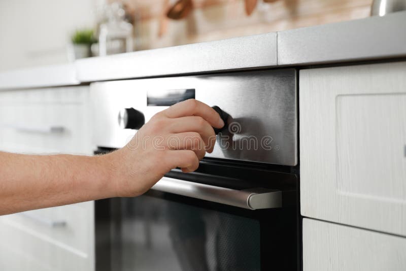 Man Regulating Cooking Mode on Oven Panel in Kitchen Stock Image ...