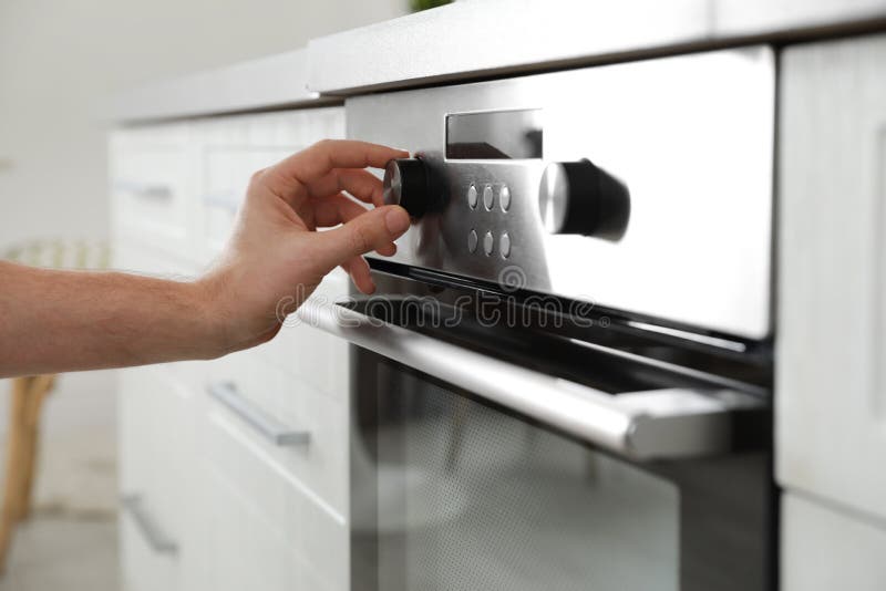 Man Regulating Cooking Mode on Oven Panel in Kitchen Stock Image ...