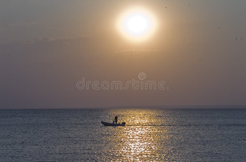 Man Relaxing on a Boat at Sunset Stock Image - Image of seascape ...