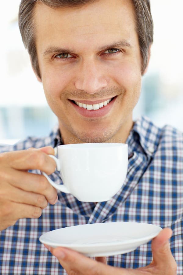 Man Relaxing with Cup of Tea Stock Image - Image of people, indoors ...