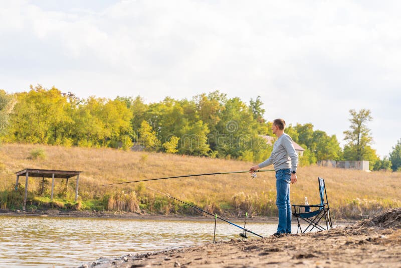 Man Relaxing and Fishing by Lakeside. Weekends Made for Fishing. Fisher ...