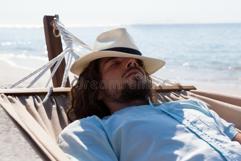 Man relaxing in hammock stock photo. Image of closed - 91796848