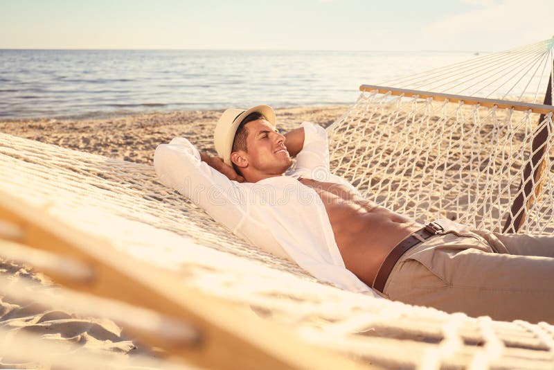 Man Relaxing in Hammock on Beach. Summer Vacation Stock Image - Image ...