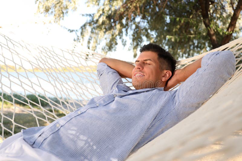 Man Relaxing in Hammock on Beach. Summer Vacation Stock Photo - Image ...