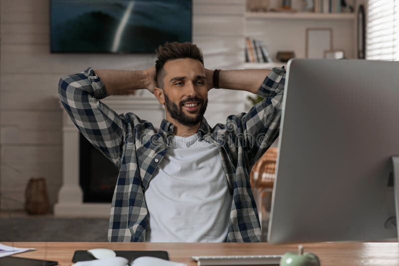 Man Relaxing Near Computer at Workplace in Home Office Stock Photo ...