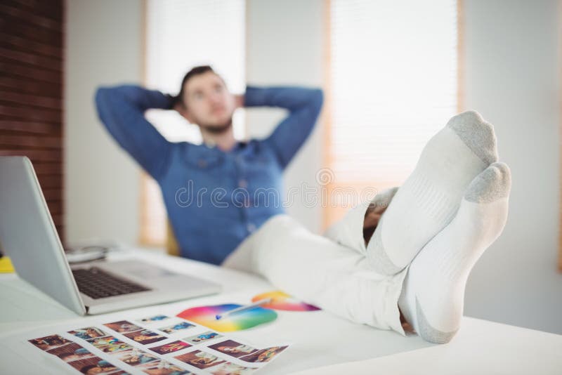 Man relaxing in office stock image. Image of profession - 77700339