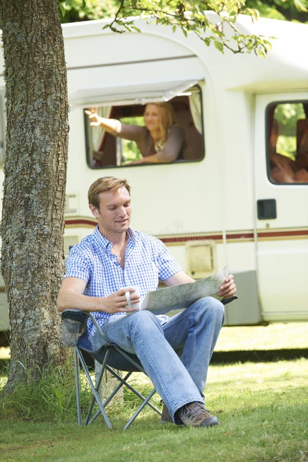 Man Relaxing Outside Mobile Home on Vacation Stock Image - Image of ...