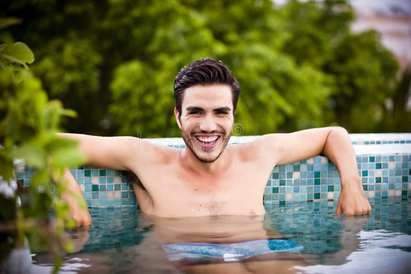 Man relaxing in a pool stock photo. Image of light, portrait - 179838360