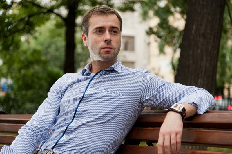 Man Relaxing in the Public Garden Stock Image - Image of male, bench ...