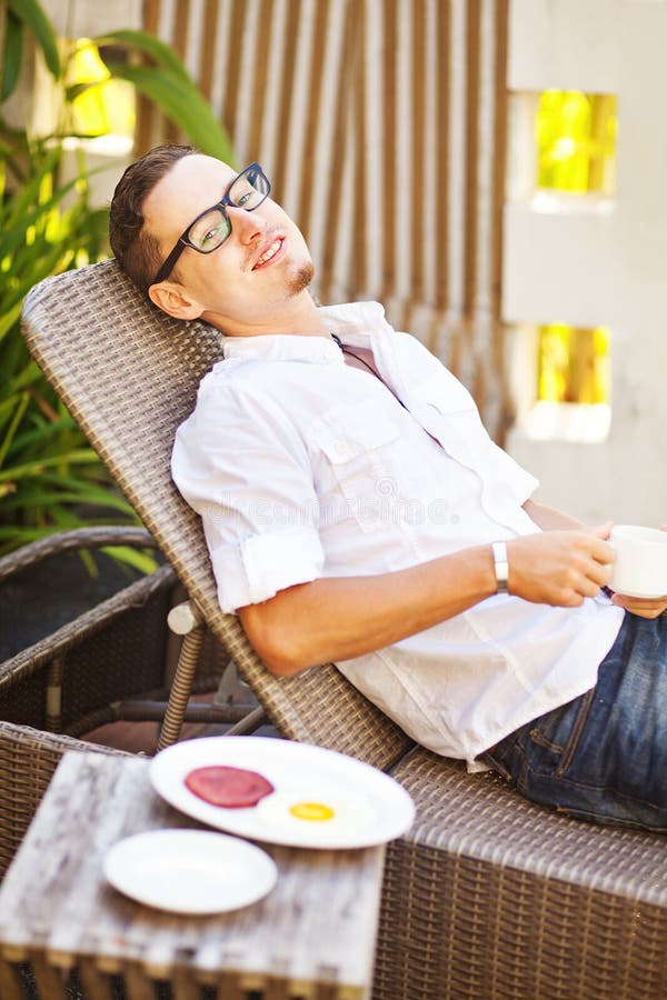 Man relaxing at resort stock image. Image of coffee, bali - 61746653