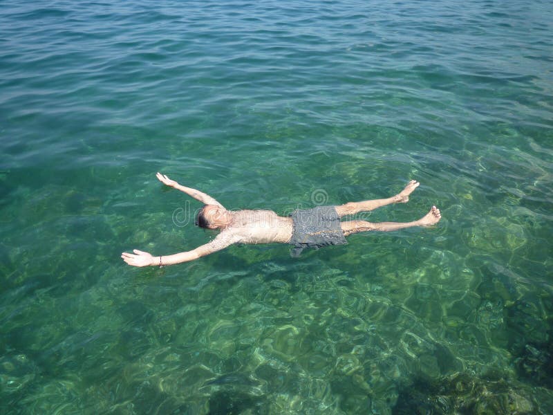 Man relaxing in the sea stock photo. Image of azur, hawai - 50525308