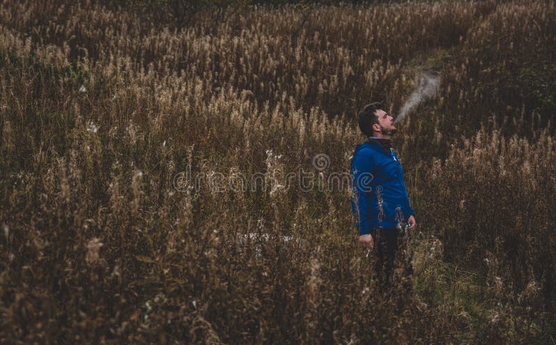 Man Relaxing while Smoking a Cigarette Editorial Stock Image - Image of ...