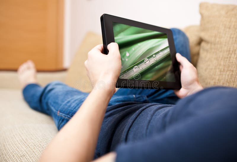Man relaxing with tablet stock photo. Image of tablet - 29380896