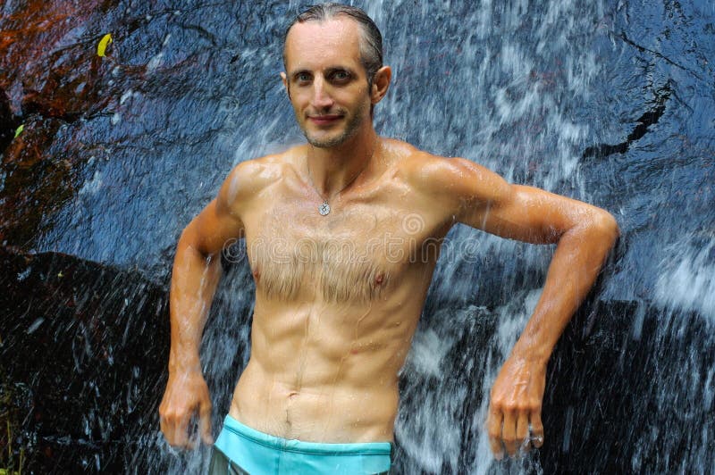 Man Relaxing Under Waterfall. Outside Stock Photo - Image of fresh ...