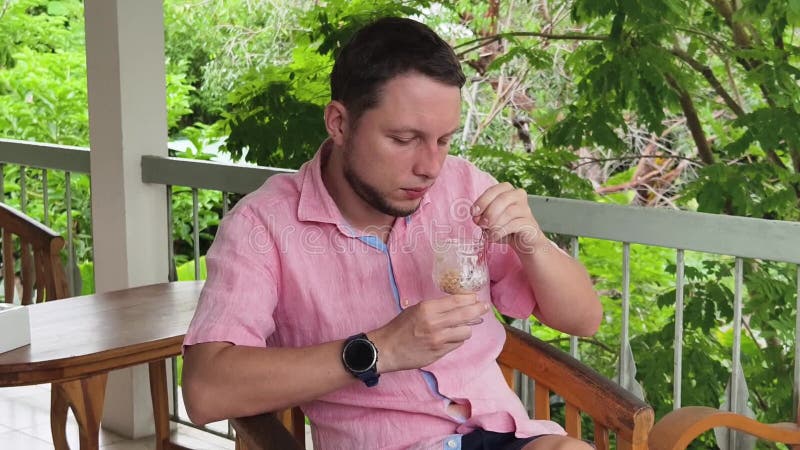 A Man is Relishing a Delightful Meal and Drinks in a Modern Cafe Stock ...
