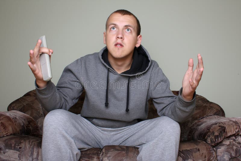 Man with remote control stock image. Image of domestic - 15993171