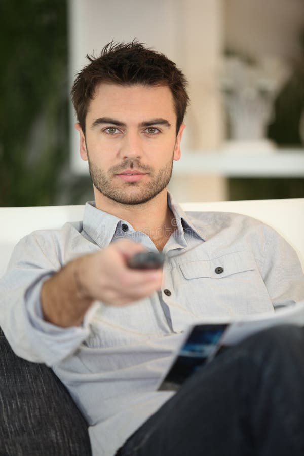 Man with remote control stock photo. Image of male, novelty - 23793084
