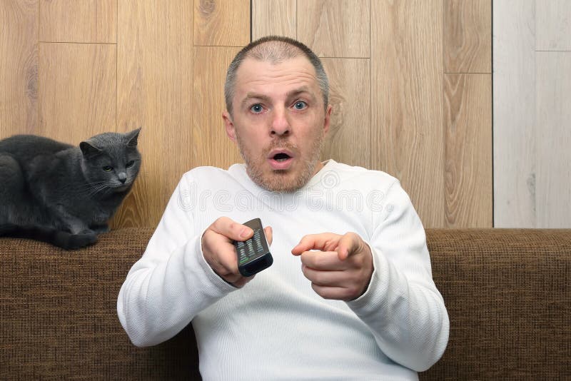 The Man with the Remote Control in Great Amazement Looking at the ...
